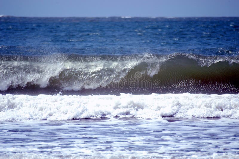 Wave Breaking on the Shoreline on the Beach #01 Stock Photo - Image of ...