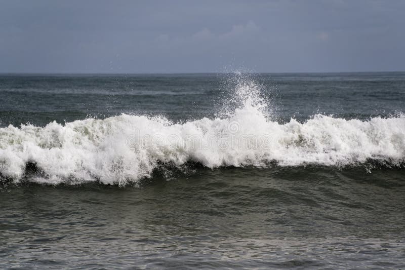 A Wave Breaks and Tumbles To the Shore Stock Image - Image of pattern ...