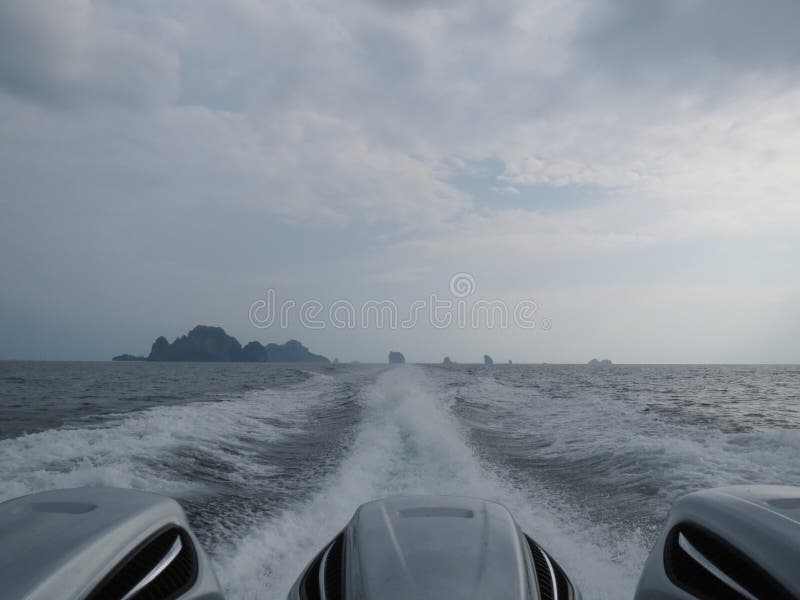 Wave Bubble Behind Speed Boat with Clouded Sky Stock Photo - Image of ...