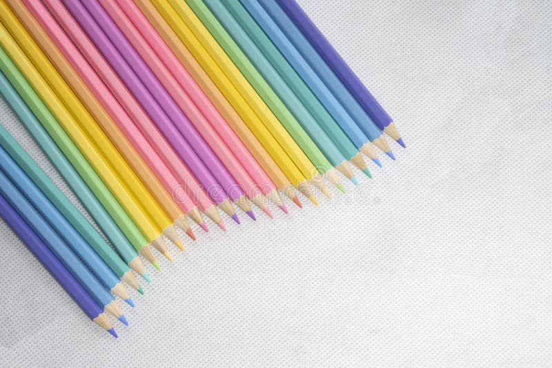 Wave of Colored Pencils,Top View Rainbow Pencils on White and Notebook ...