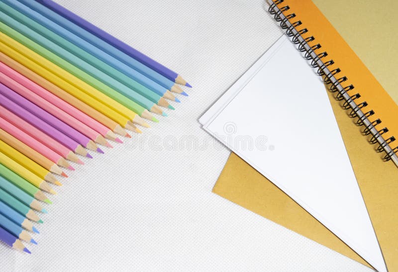 Wave of Colored Pencils,Top View Rainbow Pencils on White and Notebook ...