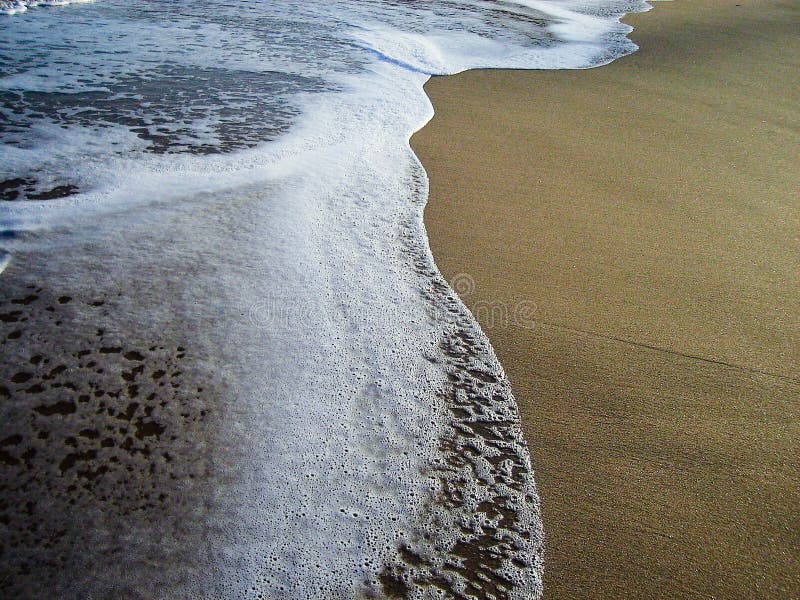 When ocean meet the sand stock photo. Image of wave - 252011616