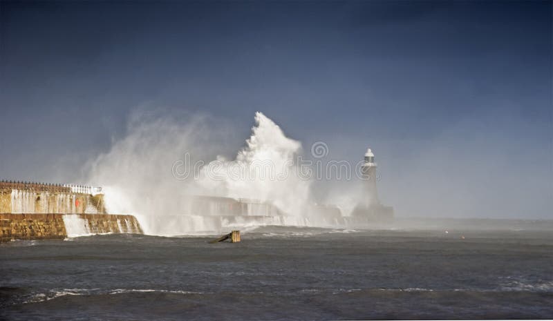 Wave Crashes Over Pier during a Storm Stock Image - Image of ocean ...