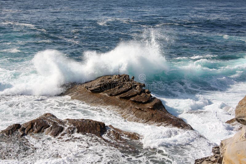 Wave crashes over rocks stock image. Image of foam, coastline - 11019997