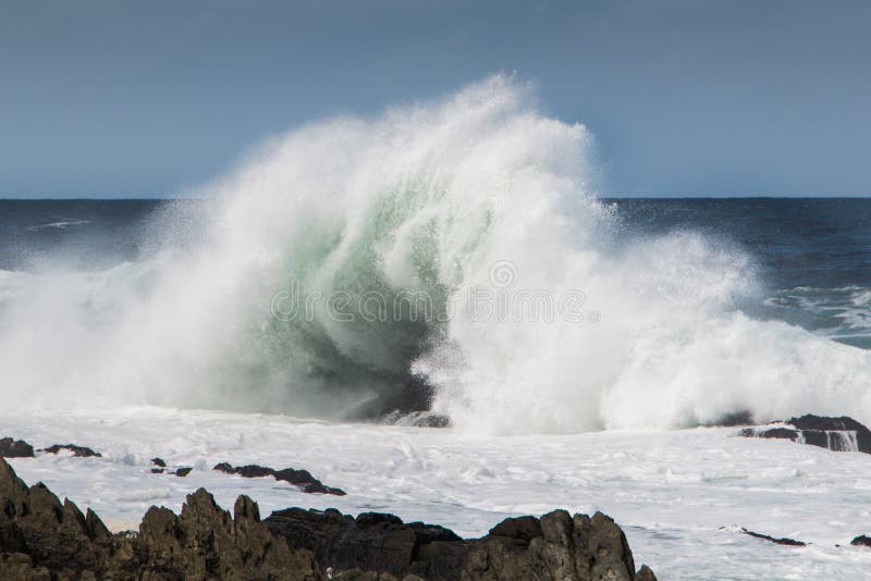 Wave Crashing Onto Rock Causing a Big Splash Stock Image - Image of ...