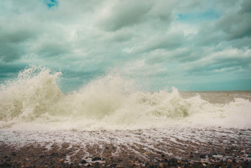 Wave crashing onto shore stock photo. Image of idyllic - 346476740