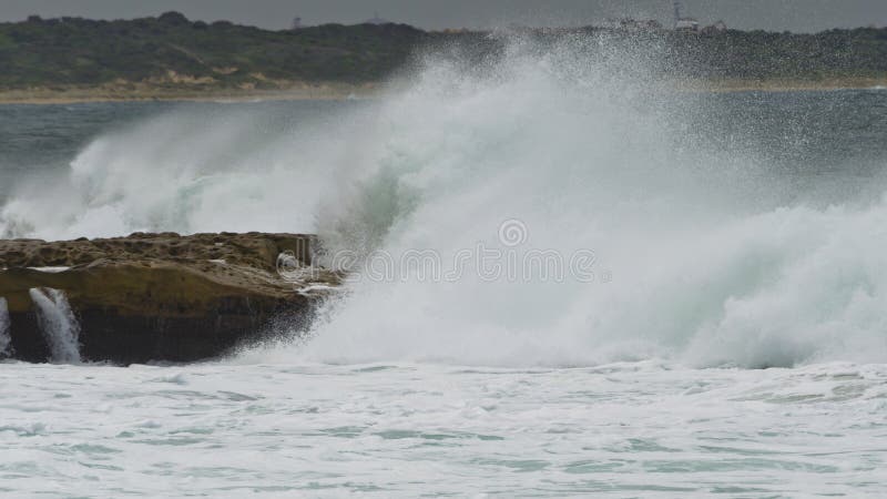 Wave Crashing into Rocks stock photo. Image of water - 52775344