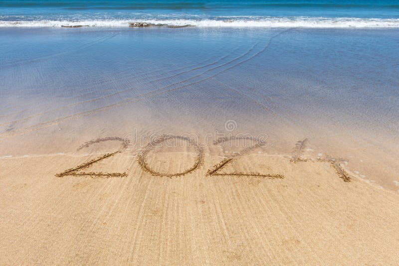Wave Erasing a 2024 Written in the Sand on the Seashore. Stock Image ...