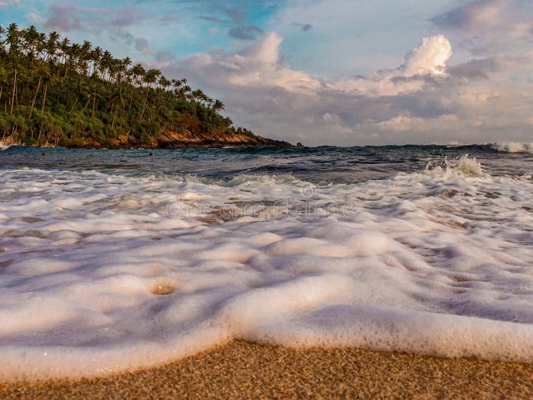 Tidal wave on the beach stock image. Image of sand, beach - 250127853