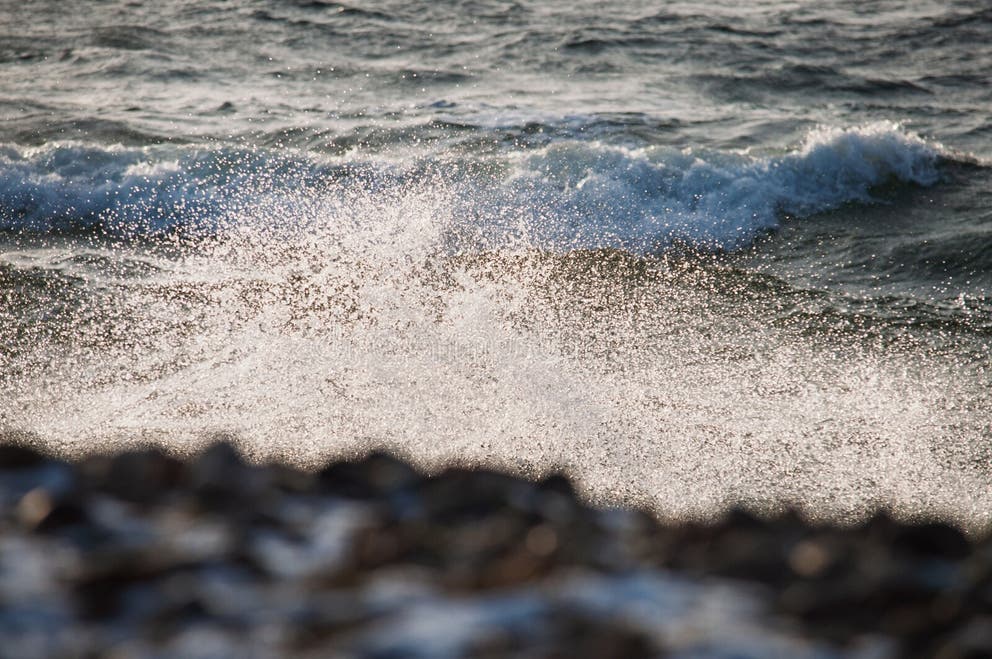 Wave Hits the Shore, Splashes Fly Stock Photo - Image of snow, water ...