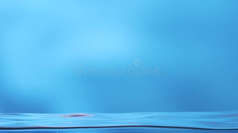 Wave Motion of Smooth Water Surface on Blue Background. Freshness of a ...