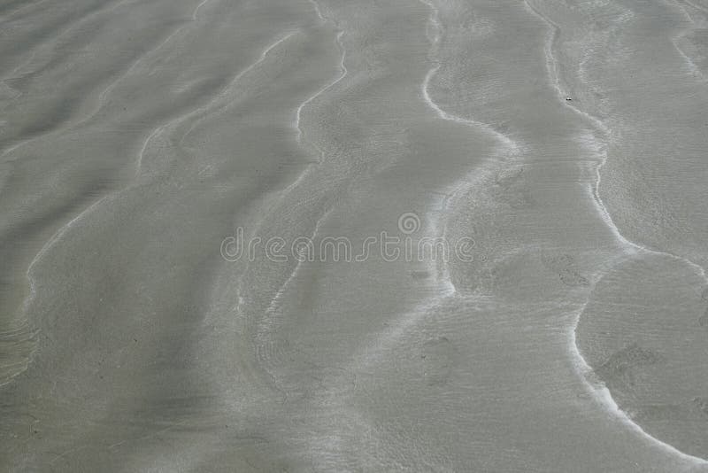 Wave Pattern Beach Sand with Footprints Stock Photo - Image of sand ...