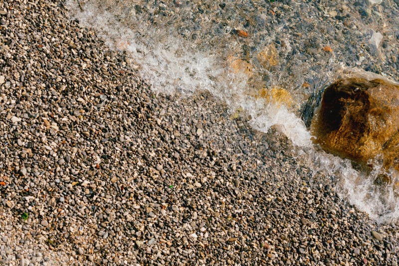 Wave on a pebble beach. stock image. Image of blue, pebble - 194235753