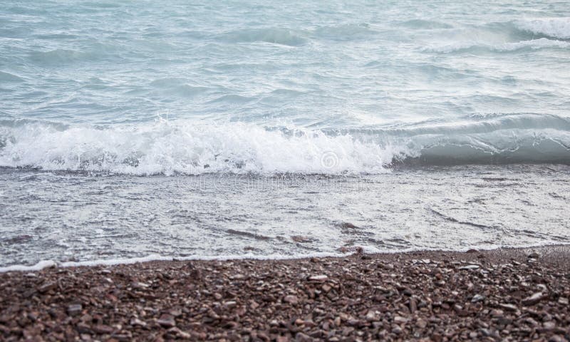 Sea wave and pebble beach stock image. Image of vacation - 98830953