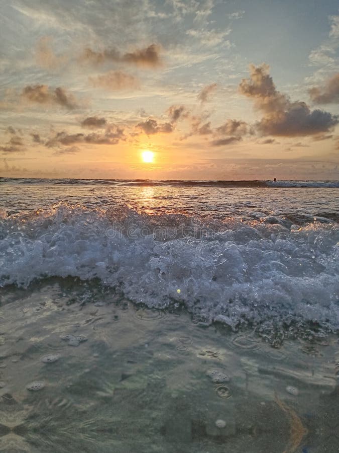 The Wave Rolling Under the Sunset Stock Image - Image of rolling ...