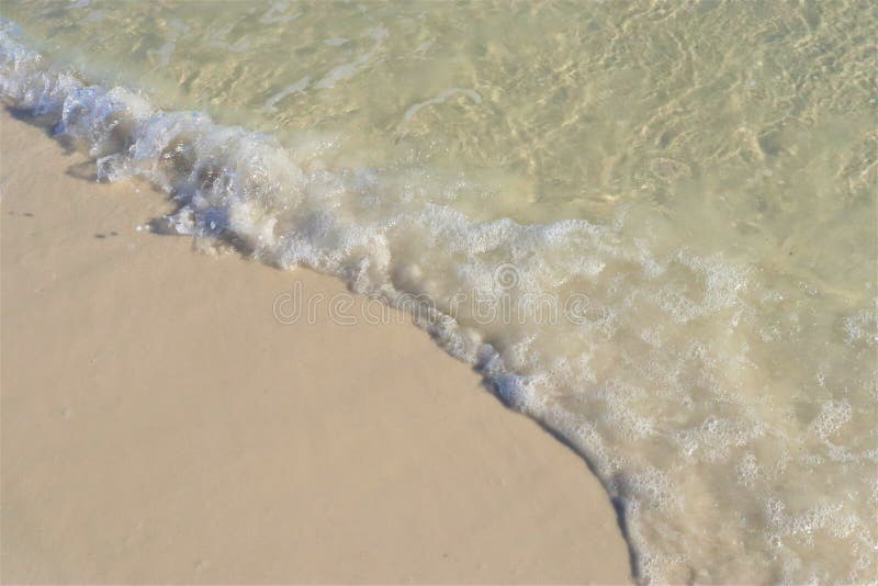 A Wave Rolls Back from the Shore Stock Image - Image of edge, exposing ...