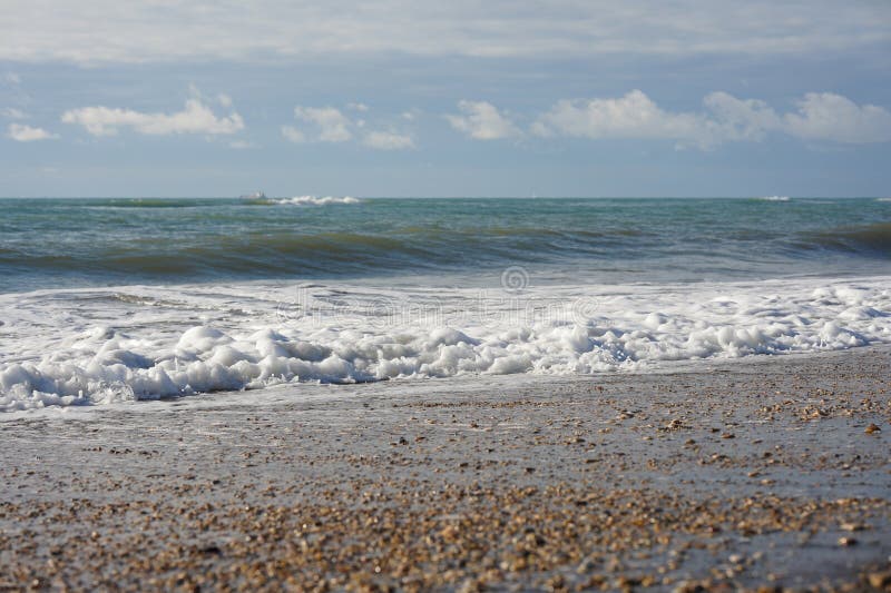 Wave is Running into the Beach and Crashing the Beach Creating Seafoam ...