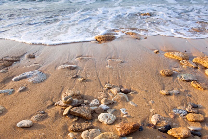 Wave of the Sea on the Beach with Sand and Stones Stock Image - Image ...