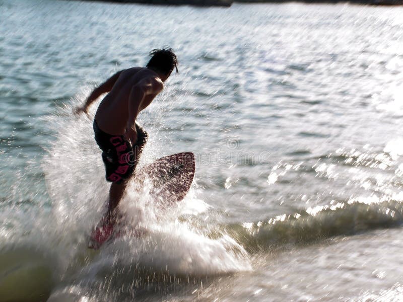 Extreme Wave skim boarding stock image. Image of physical - 1069643