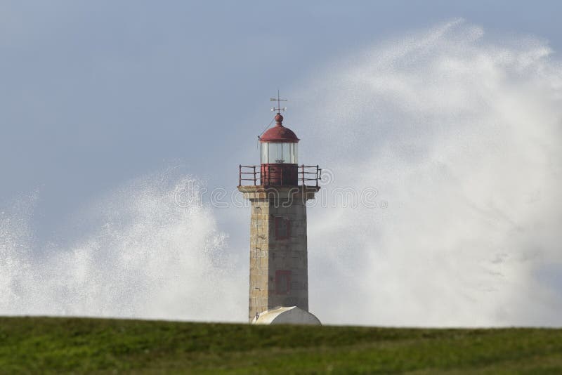 Wave Splash Over Lighthouse Stock Image - Image of power, weather ...