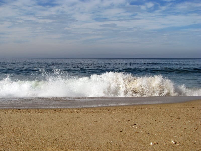 Wave splashing on beach stock image. Image of wave, splashy - 180189023