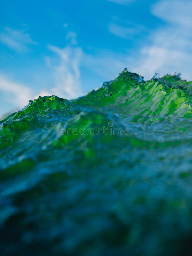 Wave Textures in Ocean. Green Wave with Sun Light and Sky Stock Image ...