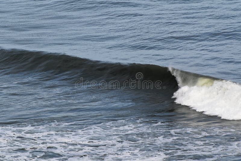 Wave Top or Crest Breaks Down the Face of the Wave Stock Photo - Image ...