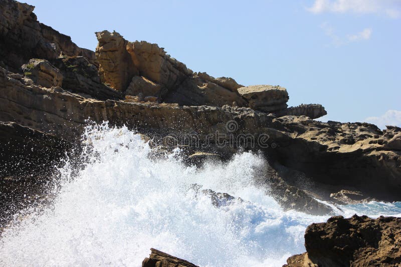Waves against the cliff stock image. Image of explore - 194857619