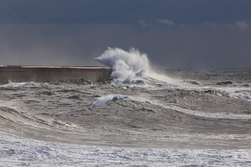 Waves against harbor wall stock photo. Image of atlantic - 76194962
