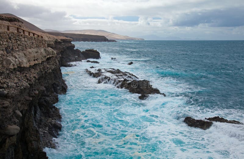 Waves at Ajuy stock image. Image of nature, eroded, boats - 27989553
