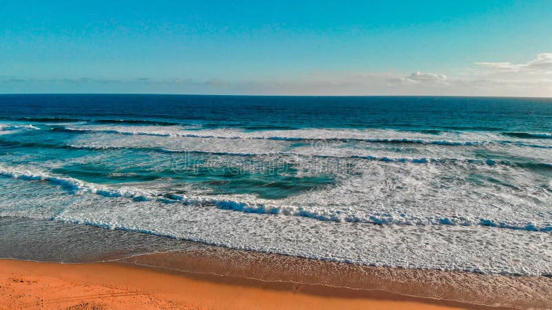 Waves Along the Shoreline at Sunset, Aerial View from Drone Stock Photo ...