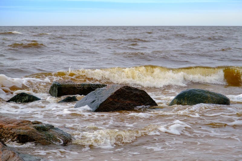 The Waves of the Baltic Sea Wash the Stones of Different Sizes on the ...