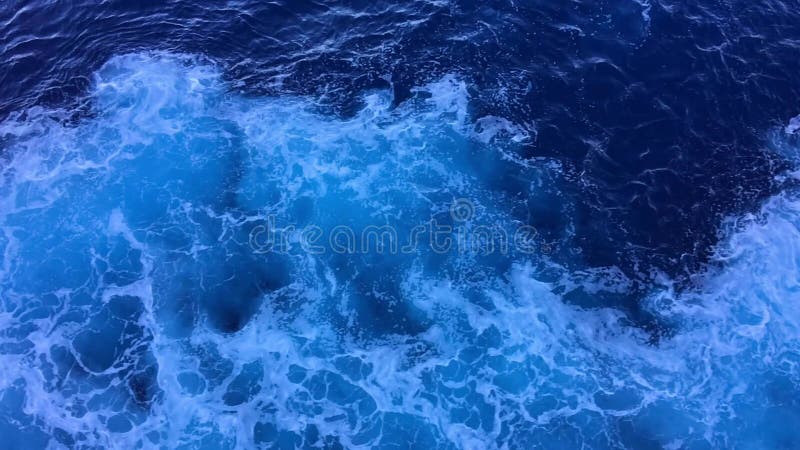 Waves with Foam Behind a Boat in Slow Motion. Patterns of Waves in ...