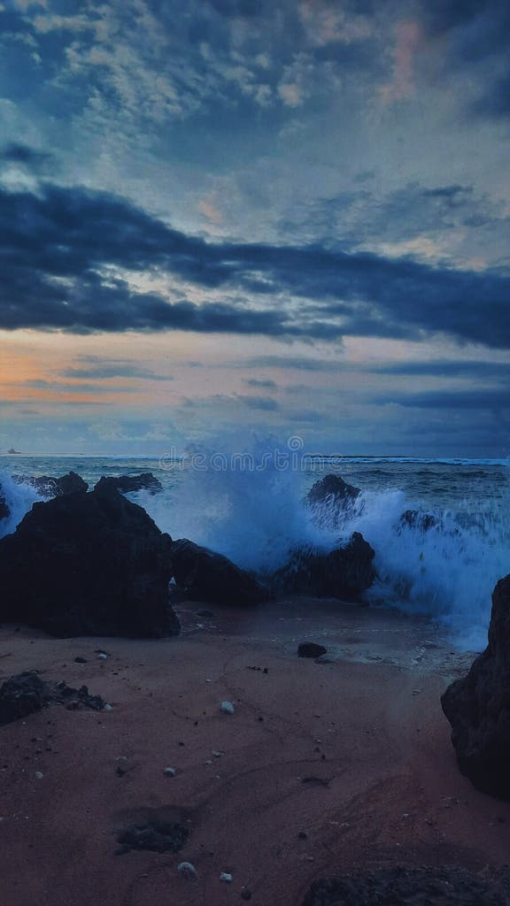 Waves Blow at Beach while Sun Goes Down Stock Image - Image of blow ...
