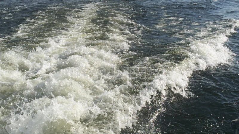 A Wave from a Ferry Moving Along the River on a Sunny Day. Stock ...