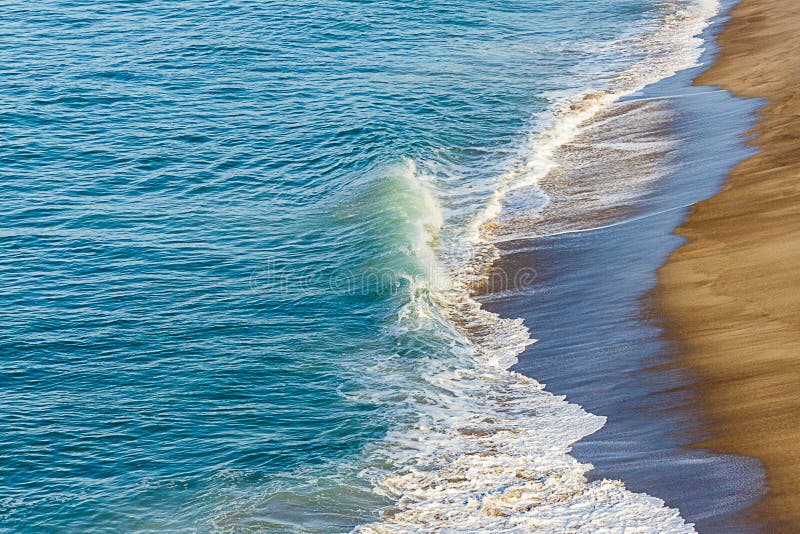 Waves Breakaing with Foam on Sandy Beach with Backwash Stock Photo ...
