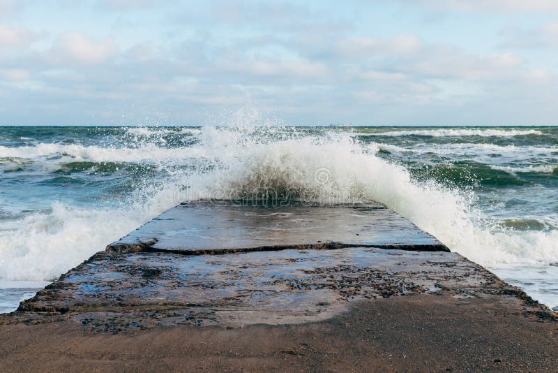 Waves Breaking on a Concrete Pier Stock Photo - Image of splash ...