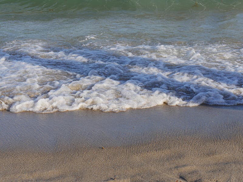 Close Up of Waves Breaking and Creating a Flowing Patterns on the Beach ...
