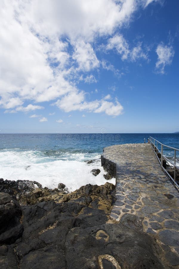 Waves breaking on jetty stock photo. Image of coastal - 5671958