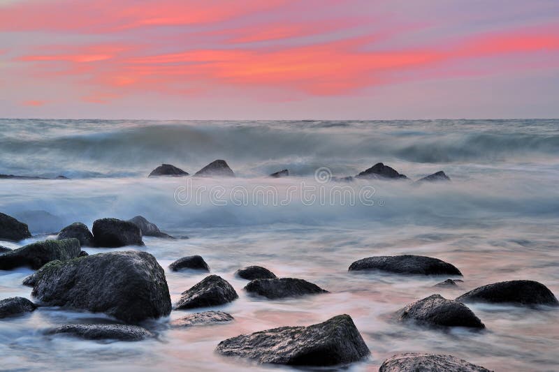 Waves breaking over rocks stock image. Image of ocean - 28599519