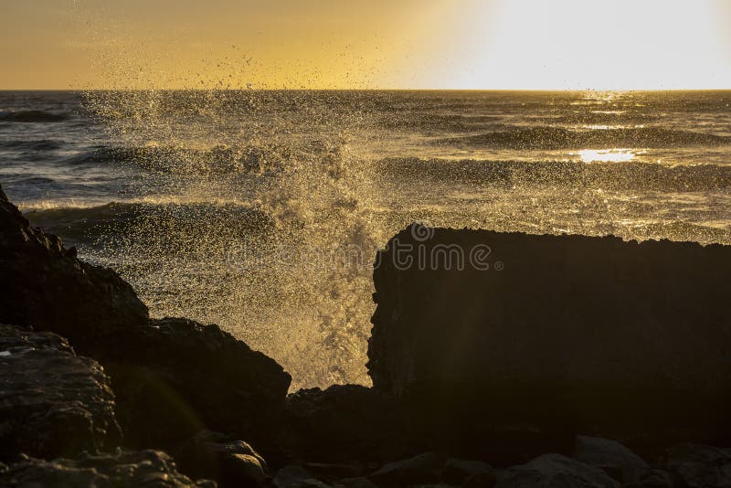 Waves Breaking Over Rocks at Sunset Stock Image - Image of abstract ...