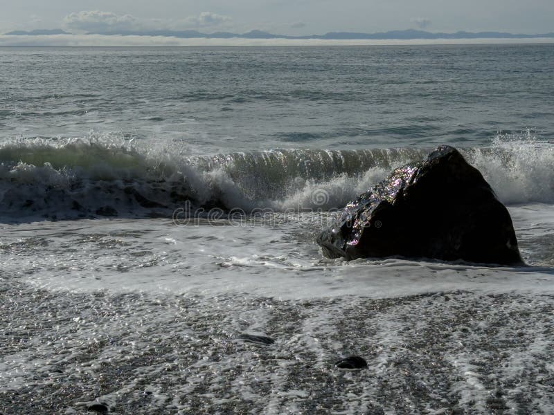Waves Breaking beside a Rock on the Coast of Vancouver Island Stock ...