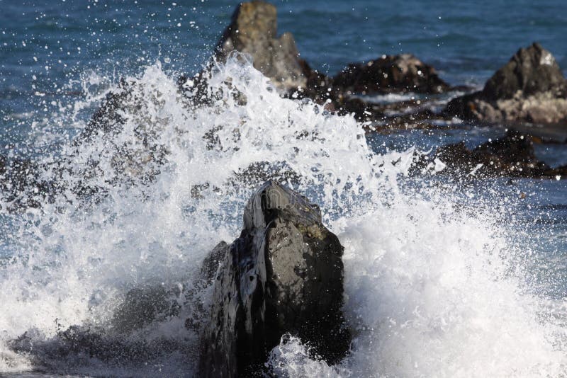Waves breaking on rocks stock photo. Image of rock, powerful - 15649866