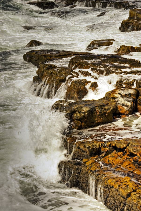 Waves breaking on rocks stock photo. Image of break, seaboard - 3928052