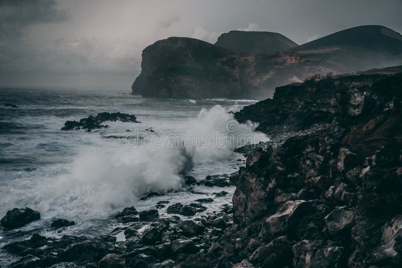 Waves Breaking on the Rocks at Night Time on the Beach Stock Photo ...