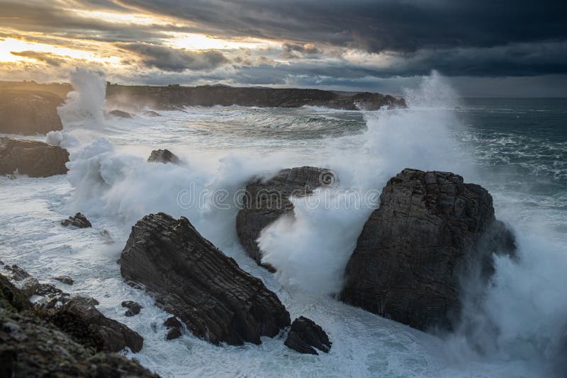 Waves breaking in rocks stock image. Image of beach - 268972745