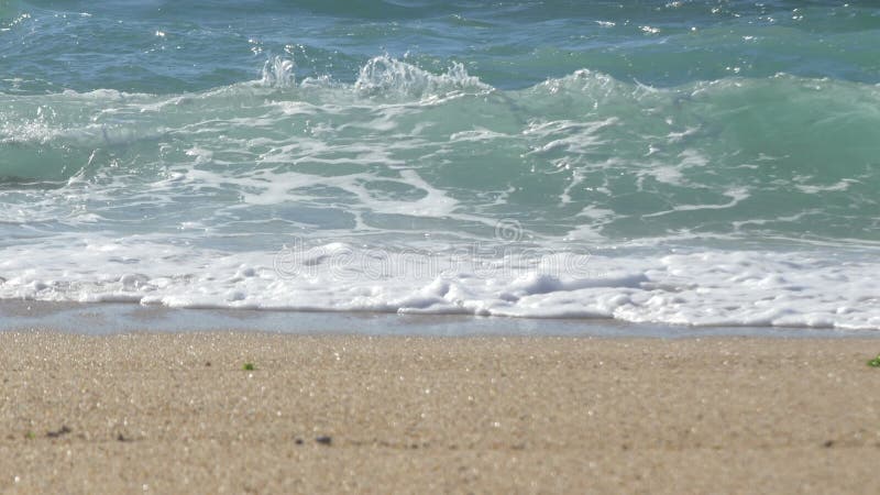 Waves Breaking on Sandy Beach. Low Angle, Shallow Depth of Field. Stock ...