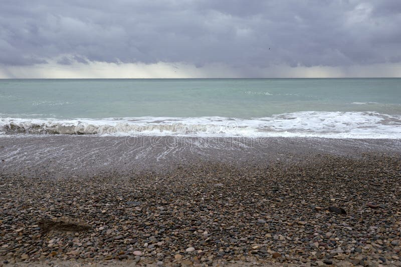Waves Breaking on the Shore on Small Pebble Beach Stock Photo - Image ...