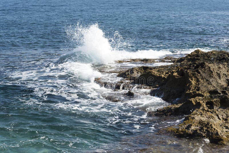 The Waves Breaking on a Stony Beach, Forming a Spray. Wave and Splashes ...
