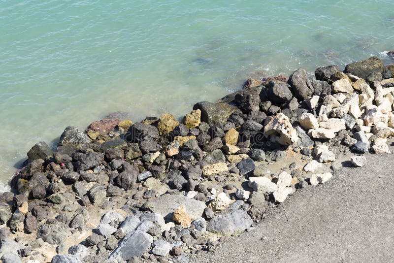 The Waves Breaking on a Stony Beach, Forming a Spray. Wave and Splashes ...